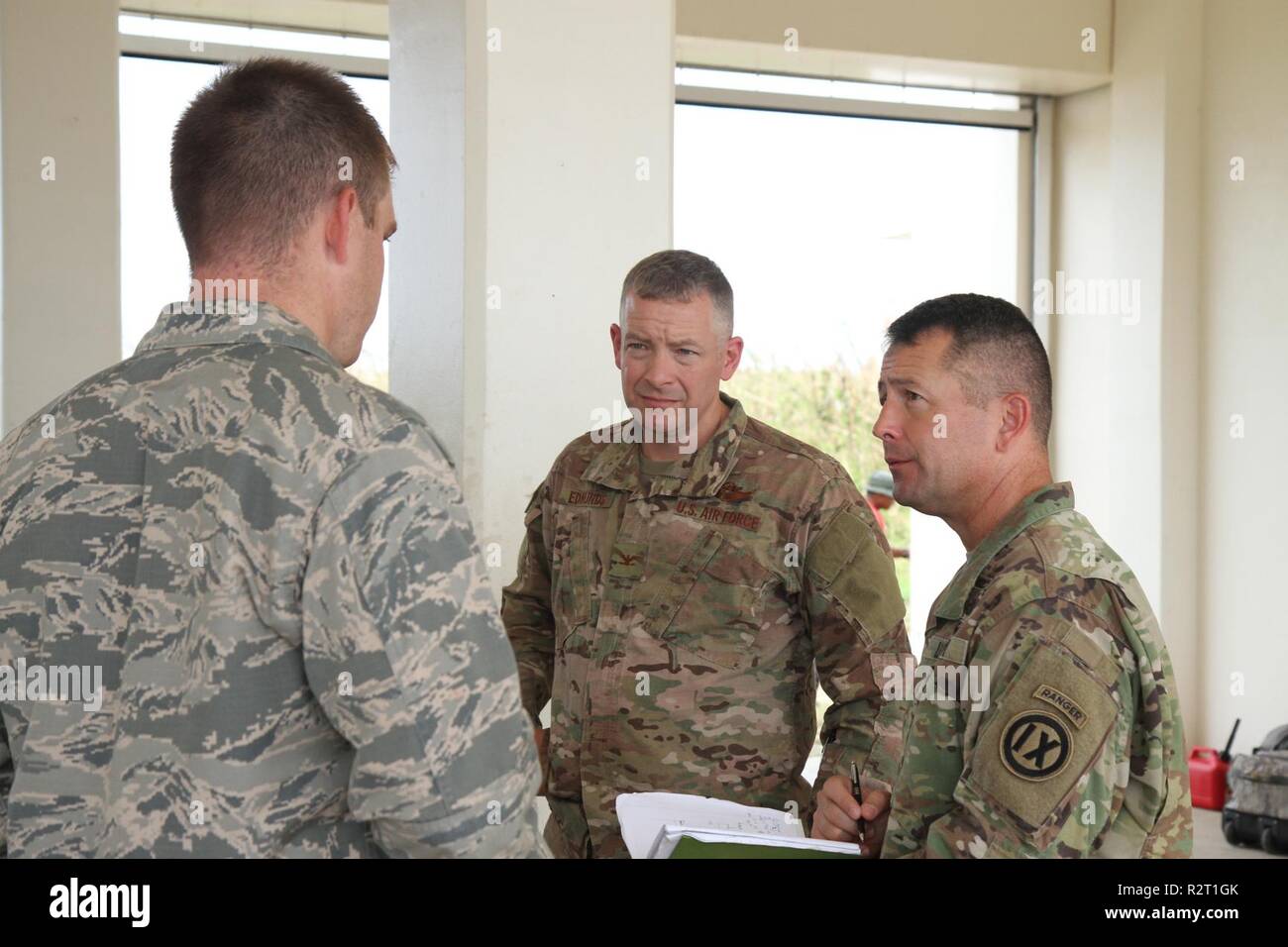 Air Force Col. William Edmunds, center, the deputy commander for Task ...