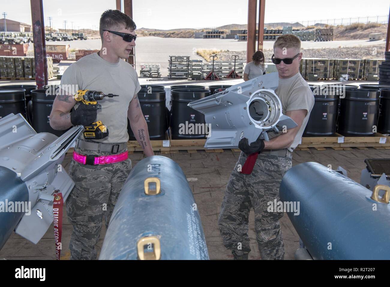 Staff Sgt. Justing Harner and Airman 1st Class Luke Johnson, munitions ...