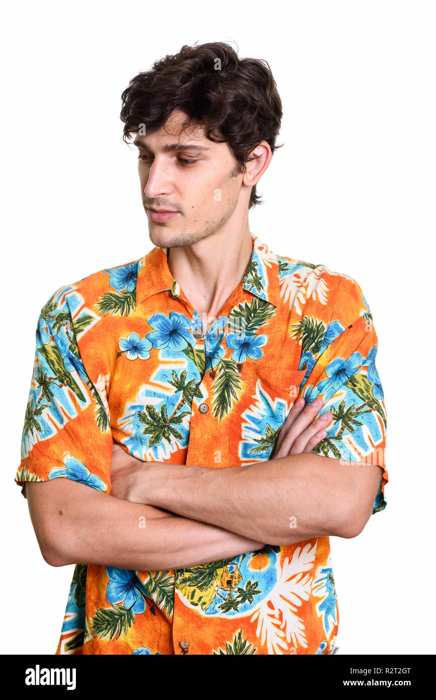 Studio shot of young handsome man thinking with arms crossed Stock ...