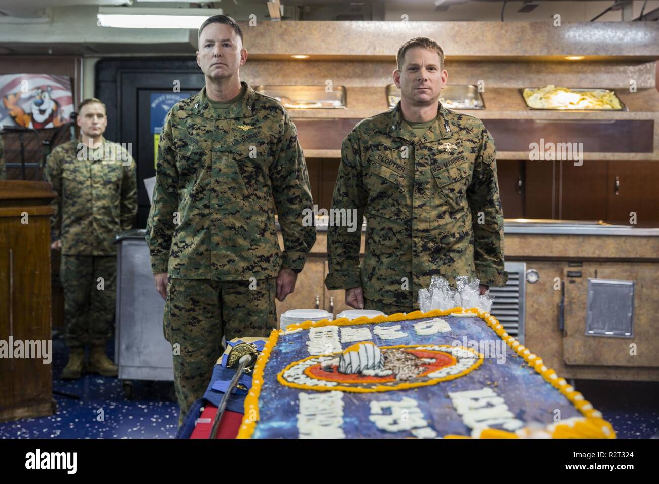 Col. Eric Cloutier, right, and Col. Robert Morgan stand at attention ...