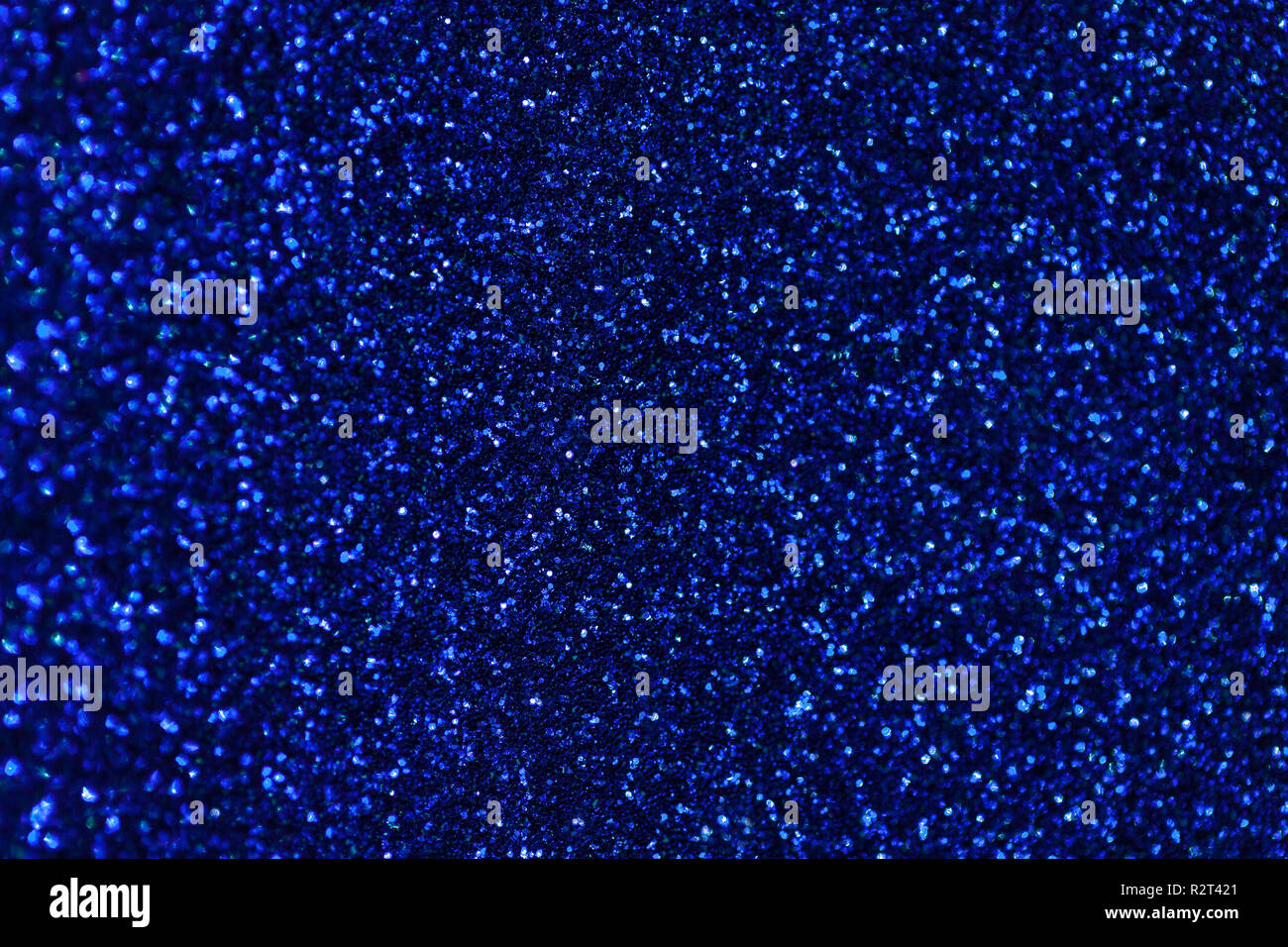 Dark navy blue sparkling background from small sequins, closeup ...