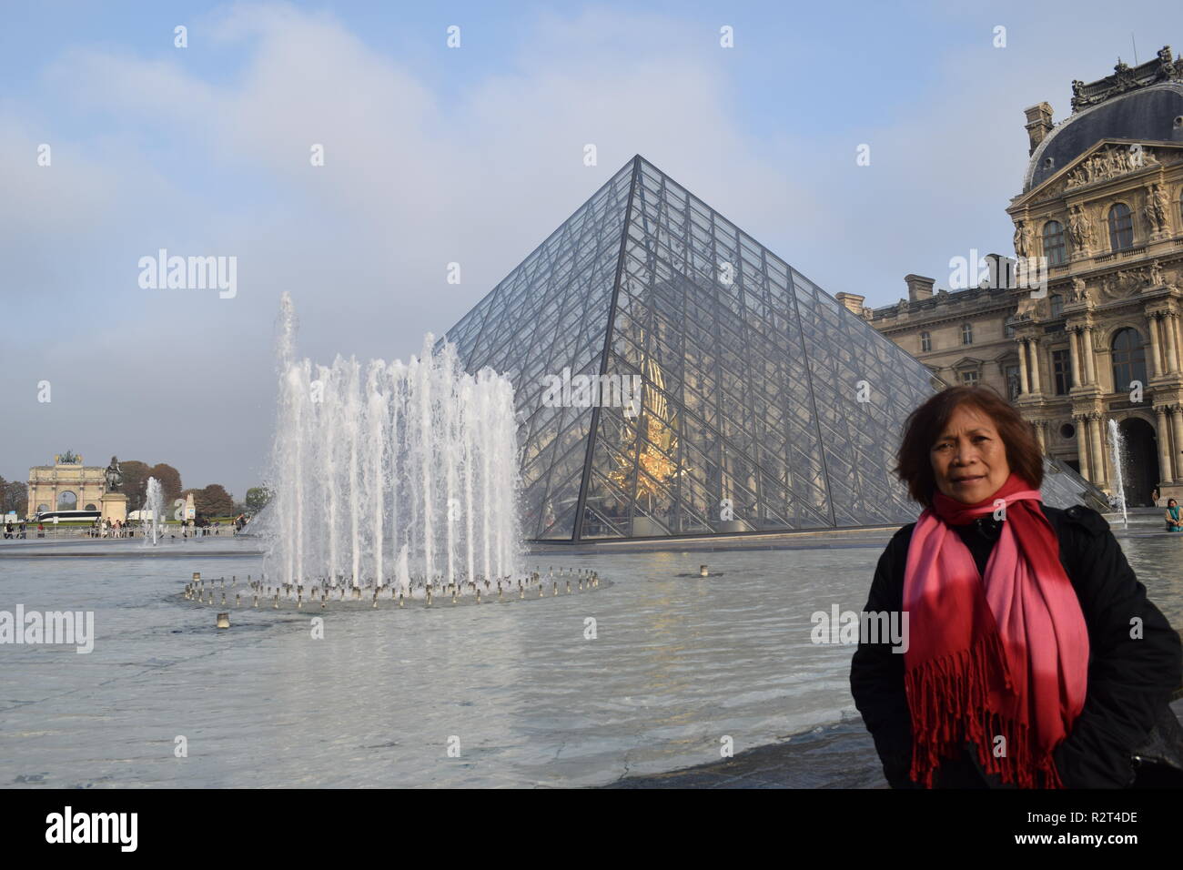 Tourists in front of the glass pyramid at the Louvre Museum Musée du ...
