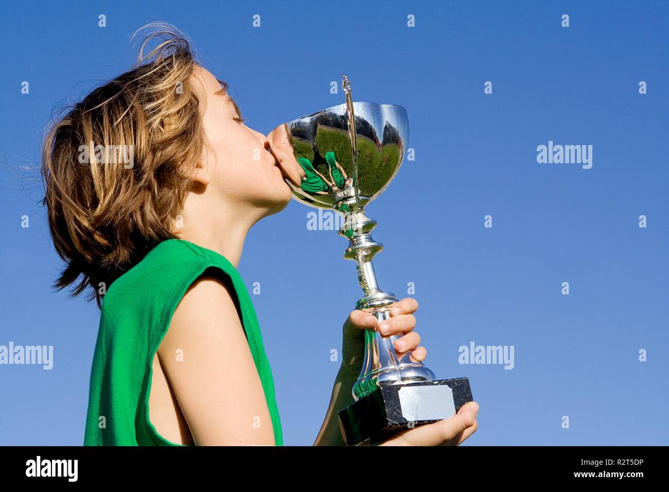 Boy kissing trophy cup hi-res stock photography and images - Alamy
