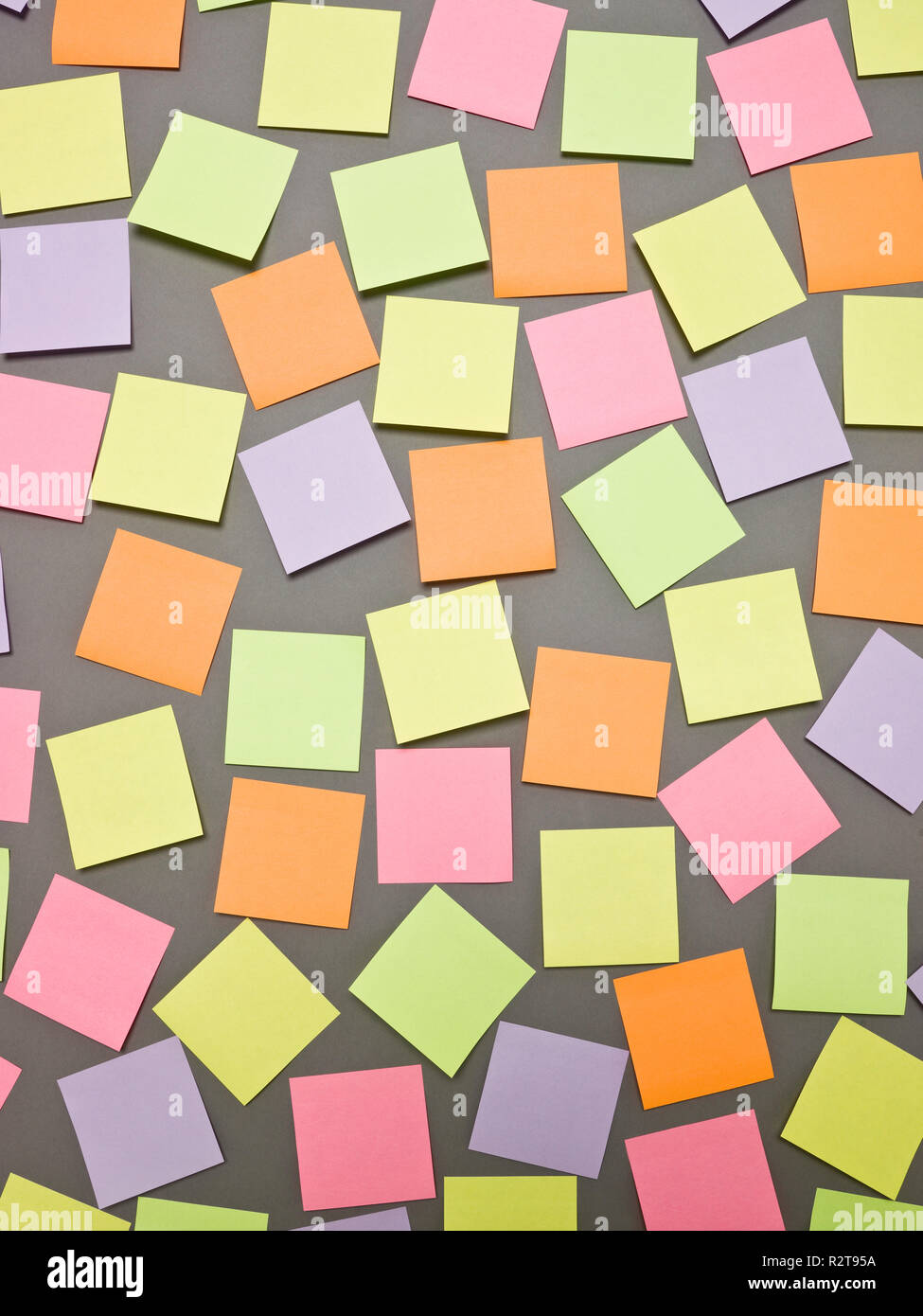Adhesive Notes with different colors on grey background Stock Photo - Alamy
