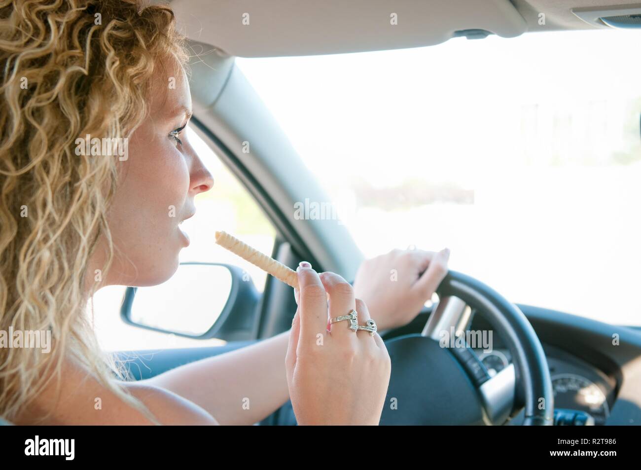 Driver eating back view hi-res stock photography and images - Alamy