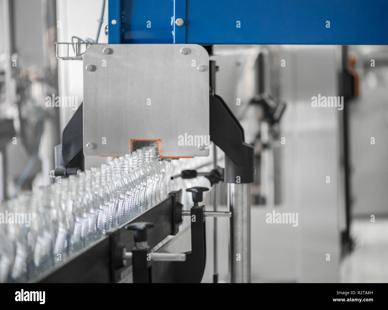 empty plastic bottles on conveyor belt. equipment at the dairy plant ...