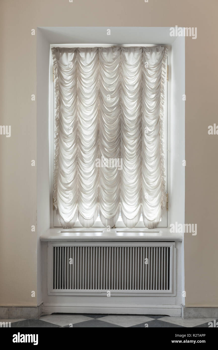 Empty window covered with white tulle, classic interior background ...