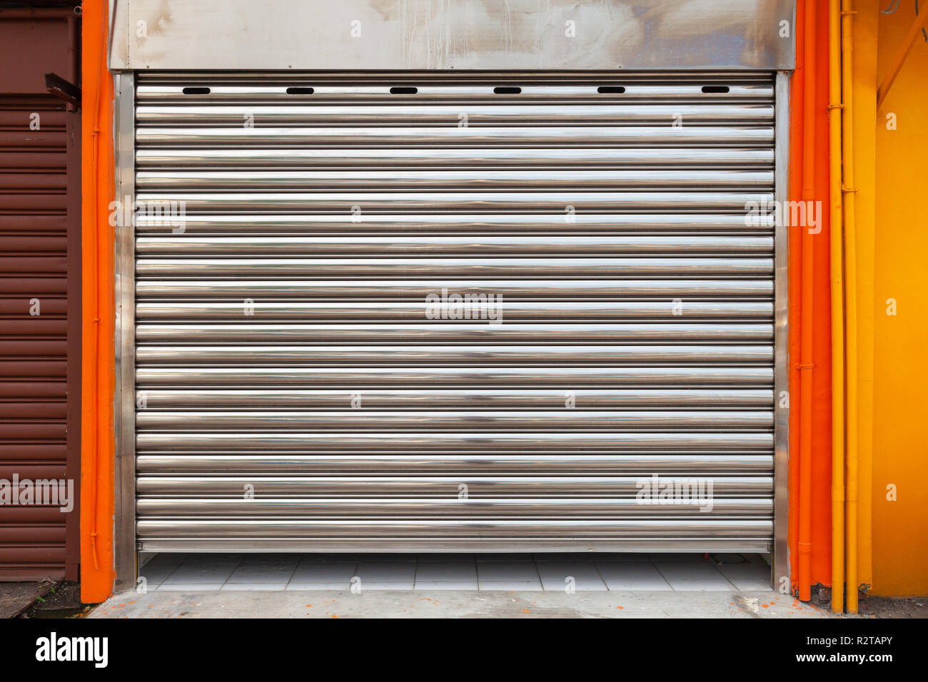Closed garage metal roll gate, background photo texture Stock Photo - Alamy