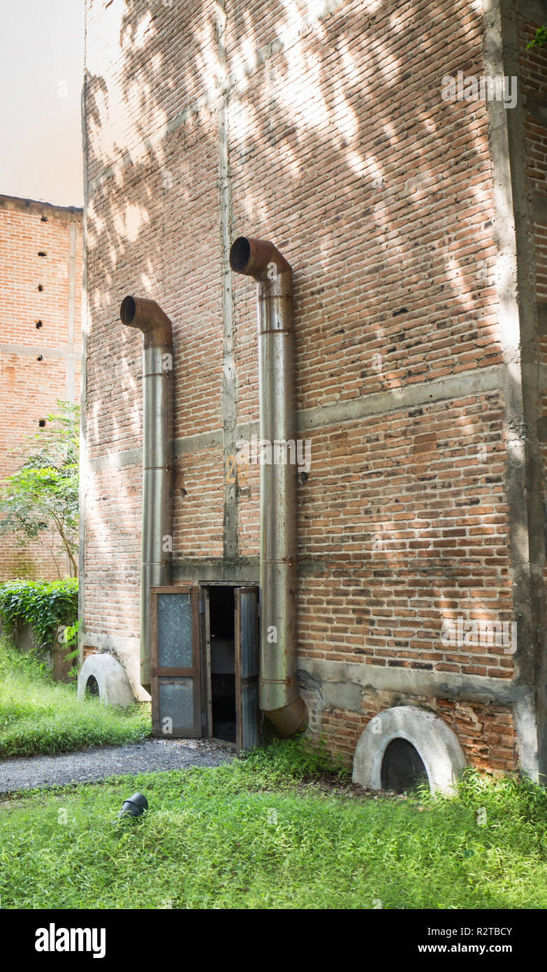 Zinc gate with old bricks wall and grass field, stock photo Stock Photo ...
