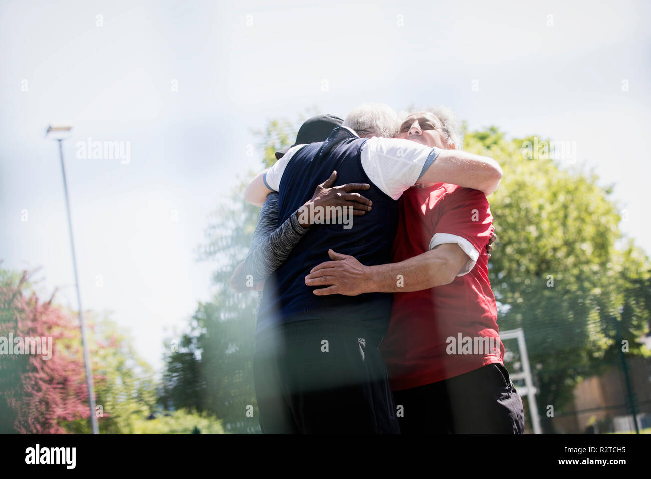 Three friends hugging hi-res stock photography and images - Alamy