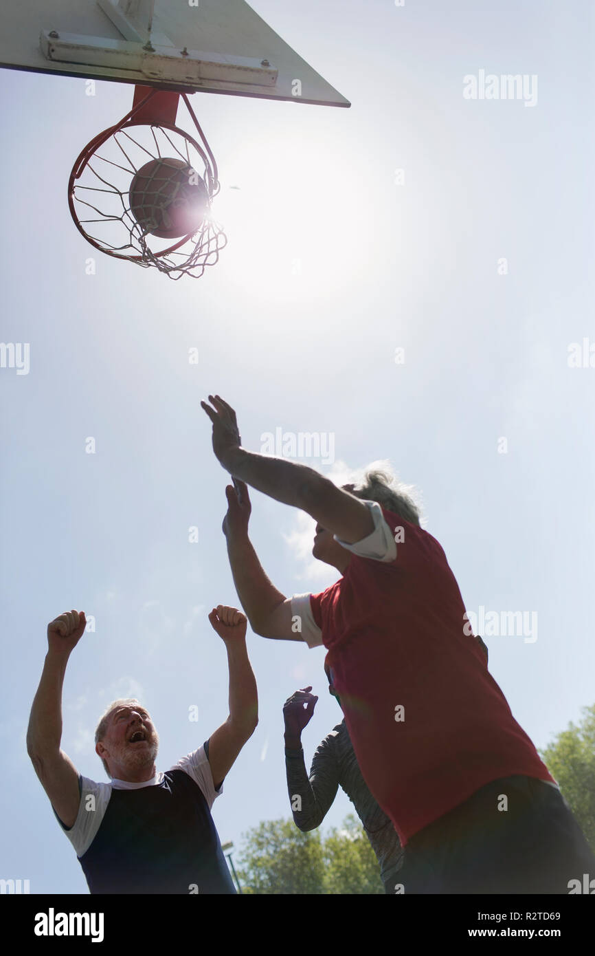 Active senior men playing basketball Stock Photo - Alamy