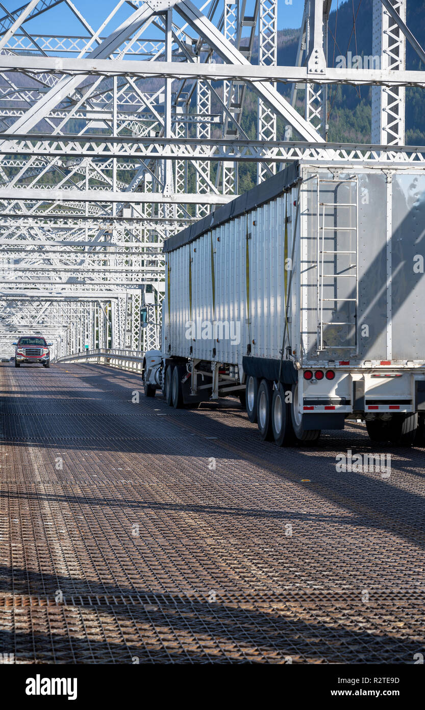 Classic American bonnet big rig burgundy semi truck with shiny ...