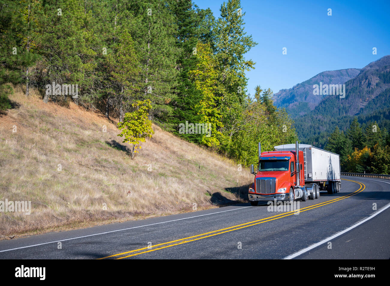 Big rig American professional powerful modern day cab long haul orange ...