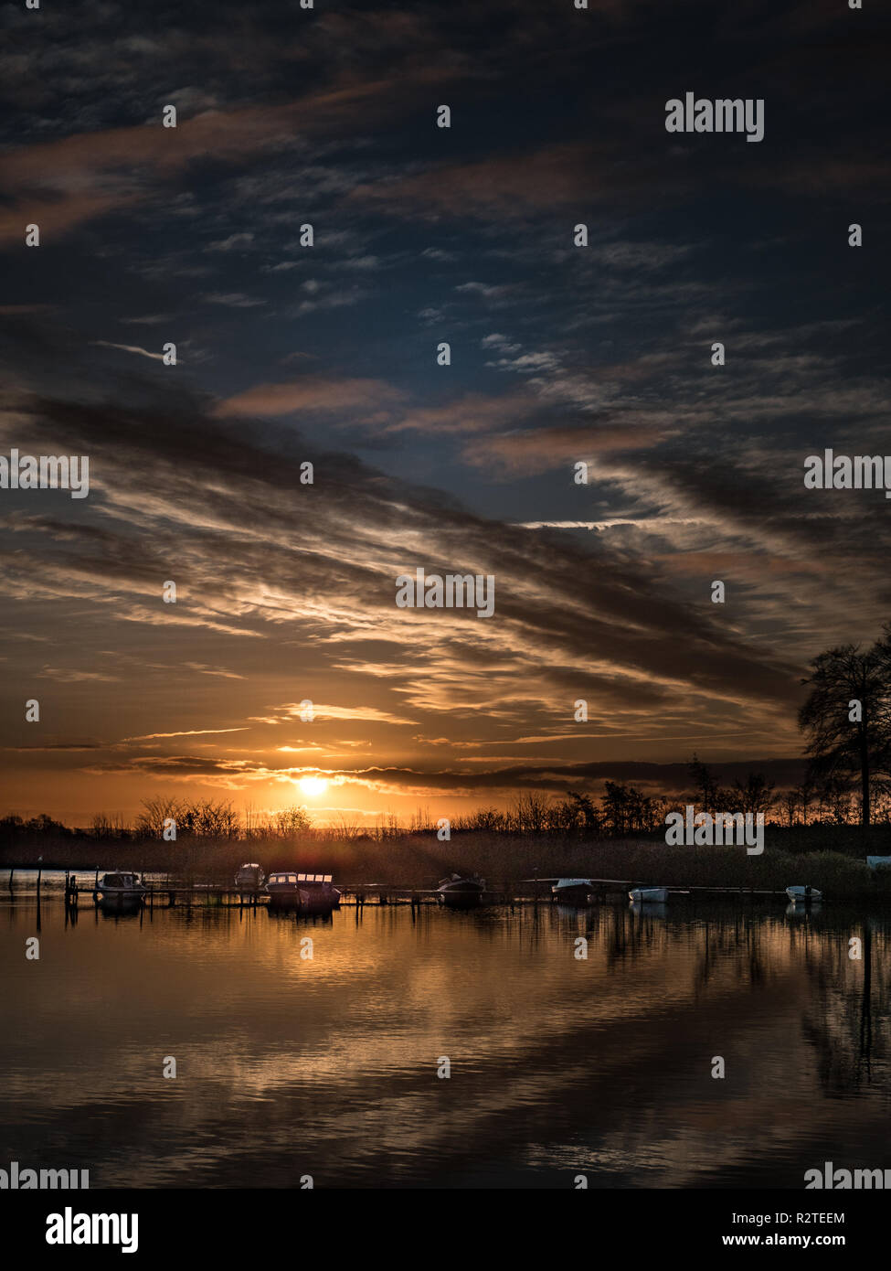 Image of a marina with water reflection and dramatic sky Stock Photo ...