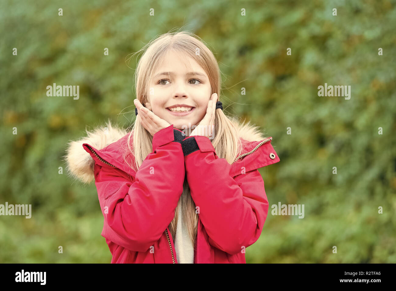 Kid fashion and style. Girl with blond hair ponytail smile on natural ...