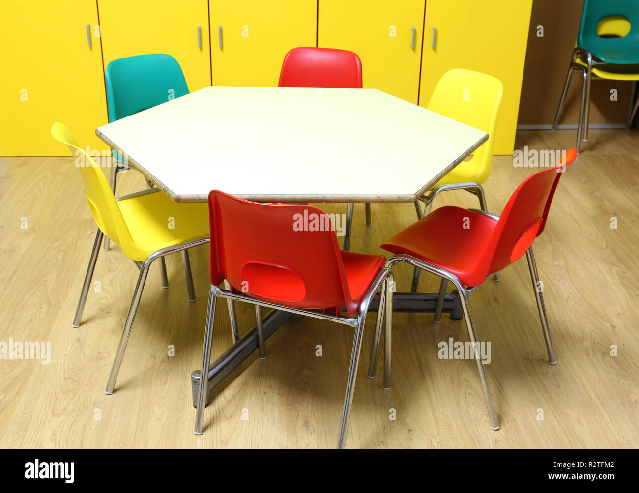 small chairs in the classroom of the primary school with wooden floor ...