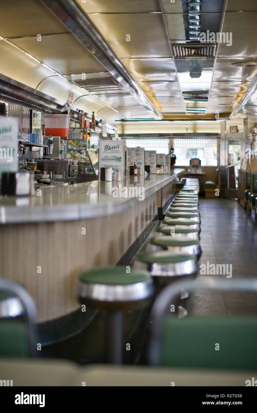 Stools along counter in old fashioned diner Stock Photo - Alamy