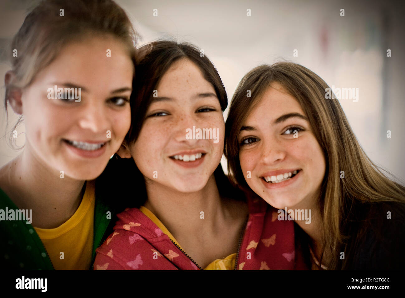 Portrait of three smiling teenage girls at school Stock Photo - Alamy