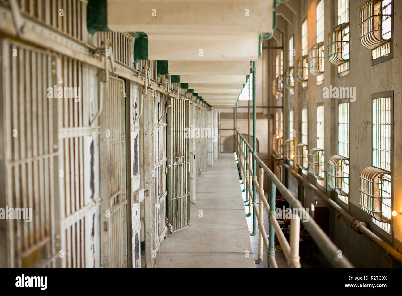 Cells of an empty derelict prison Stock Photo - Alamy