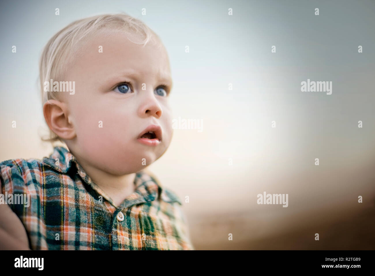 Surprised young toddler with his mouth open Stock Photo - Alamy