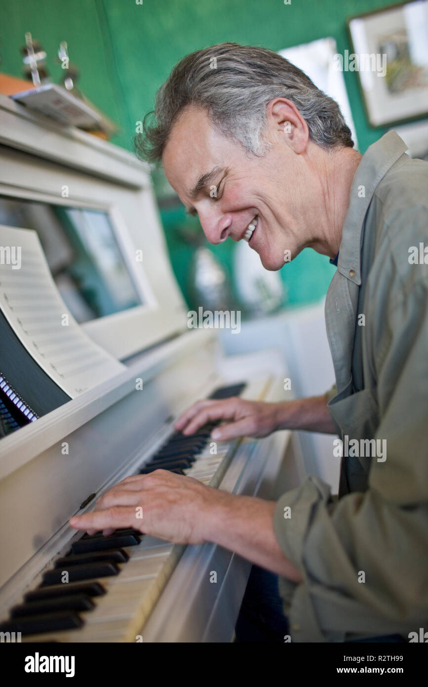 Male musician playing upright piano hi-res stock photography and images ...
