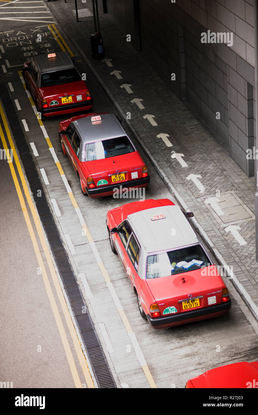 Line of taxi cabs in a narrow city street Stock Photo - Alamy