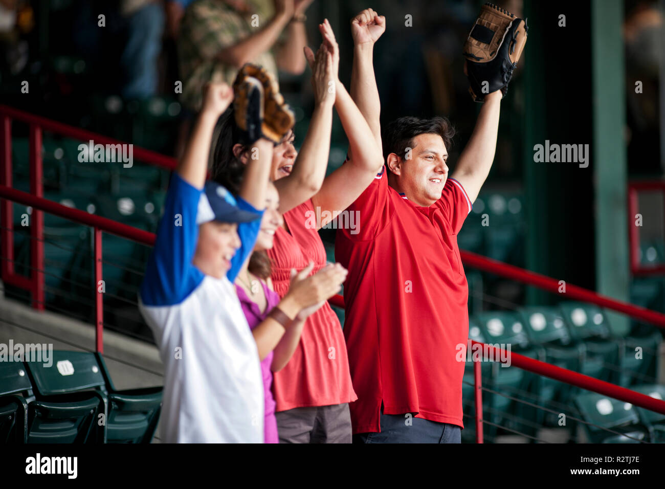 Family cheering on a baseball game at a sports stadium Stock Photo - Alamy