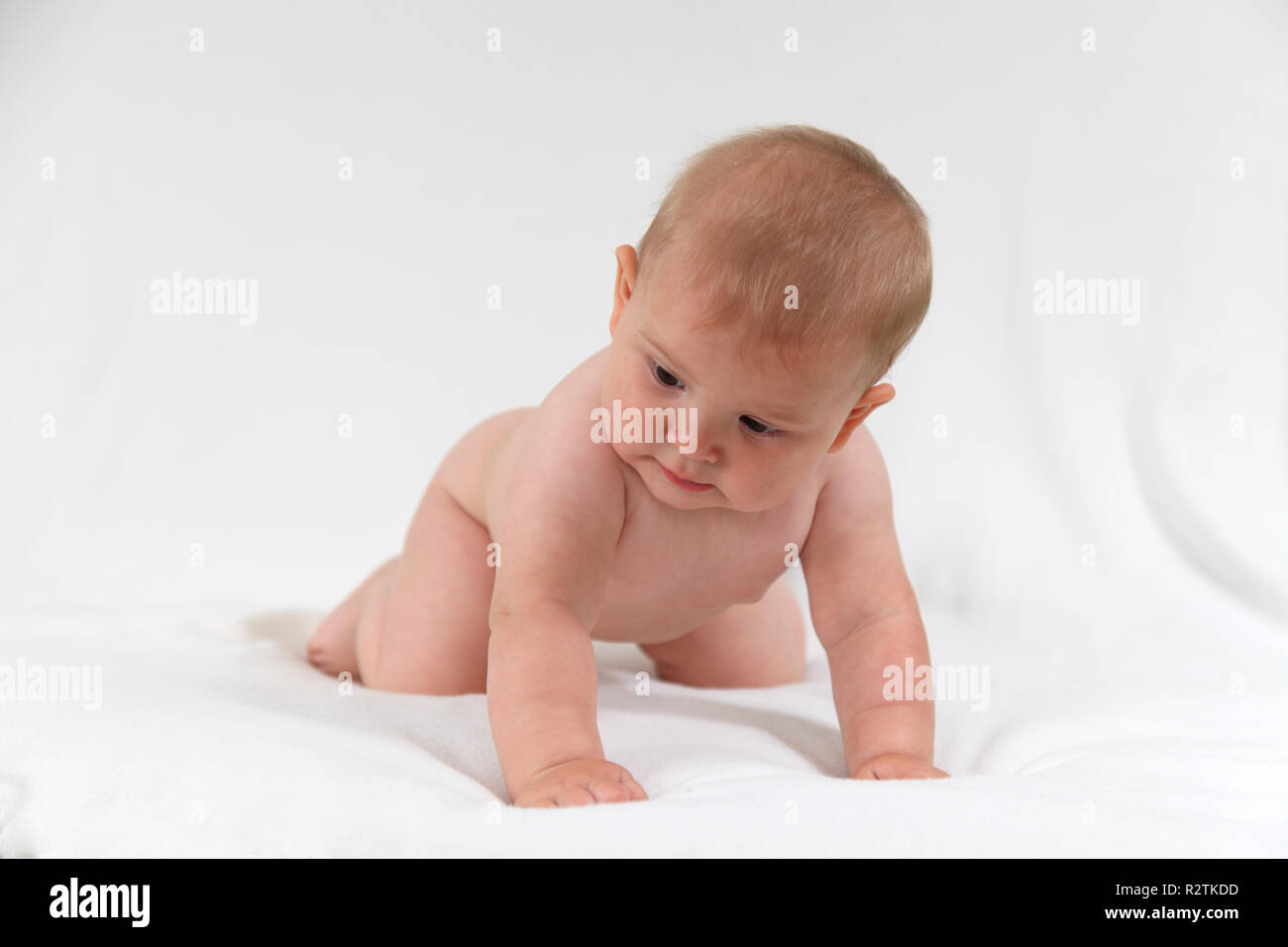 Baby crawling in bed hi-res stock photography and images - Alamy