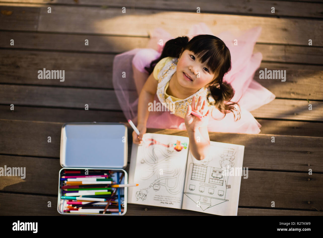 Young girl coloring Stock Photo - Alamy