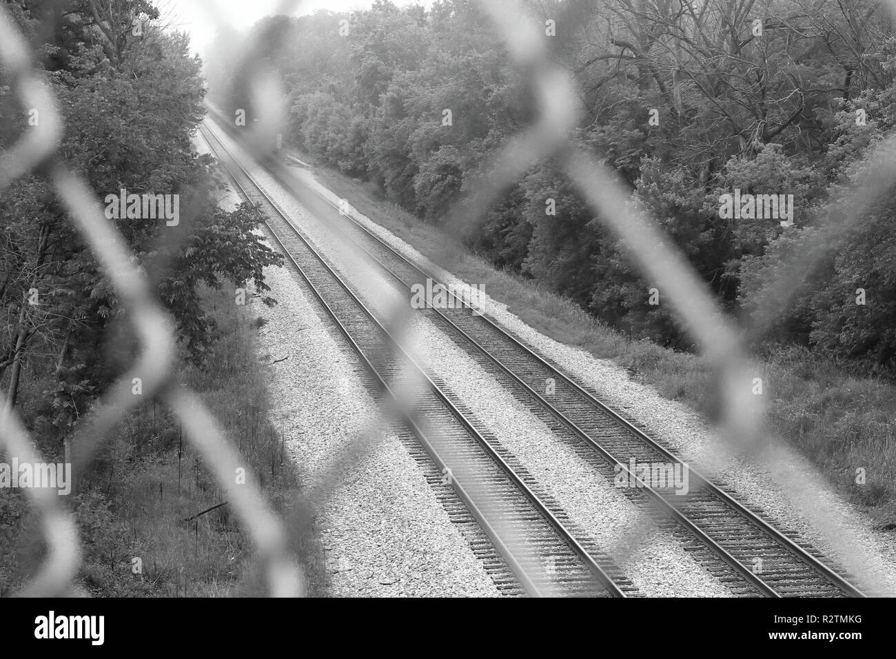 Railroad behind the wire mesh Stock Photo - Alamy