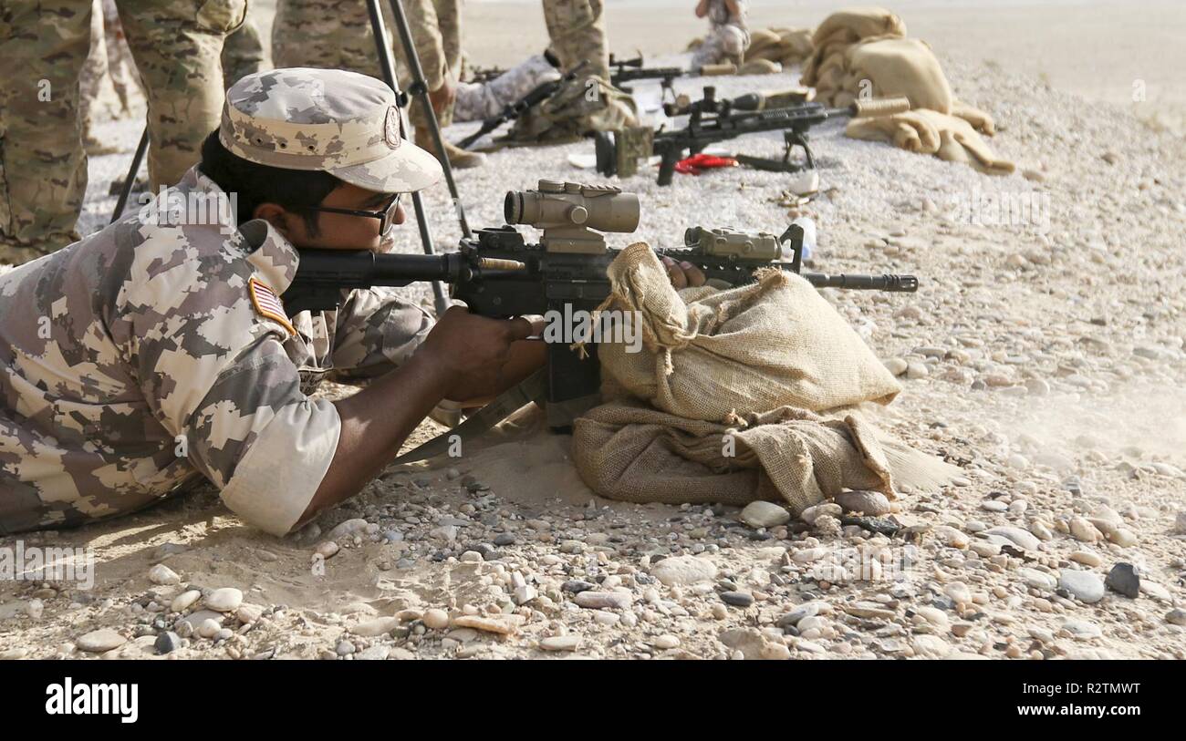 UM HATTAH, Qatar – A piece of brass escapes from the M4 carbine, as a ...