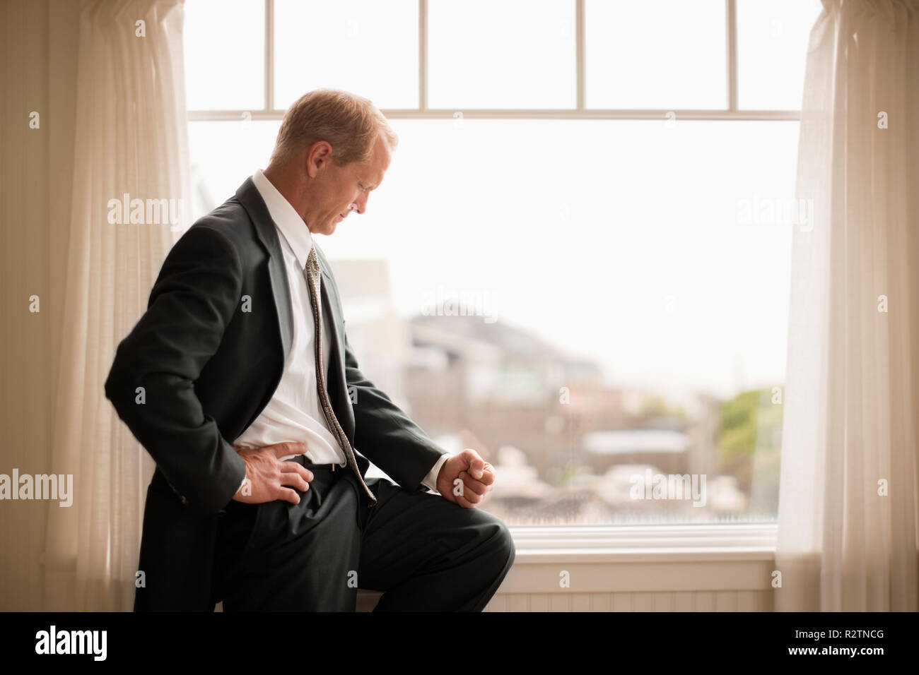 Adult look out window of home hi-res stock photography and images - Alamy