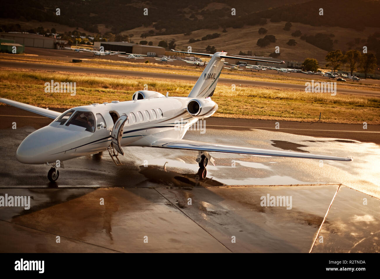 Private jet sitting in an airport Stock Photo - Alamy