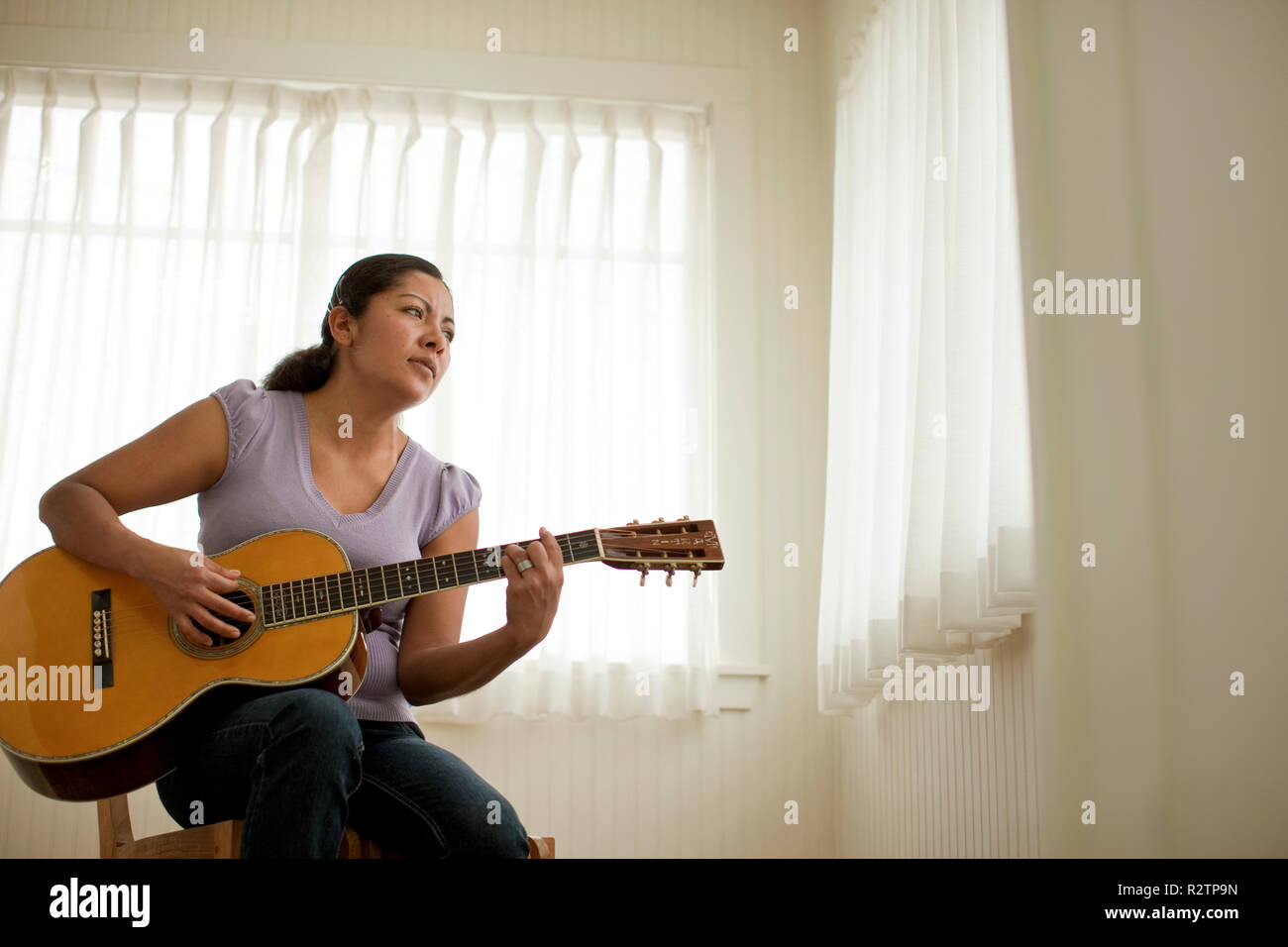 Seriously looking hispanic women hi-res stock photography and images ...