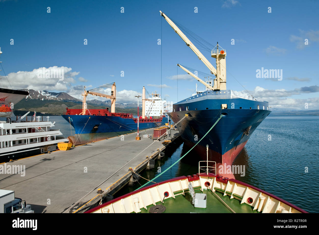 Empty wharf is surrounded by large ships Stock Photo - Alamy