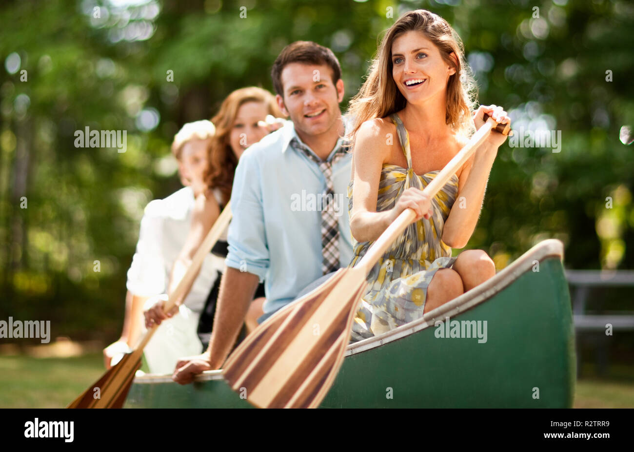 Young friends rowing boat hi-res stock photography and images - Alamy