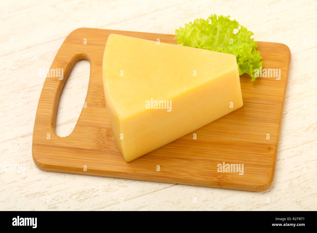 Parmesan cheese triangle Stock Photo - Alamy