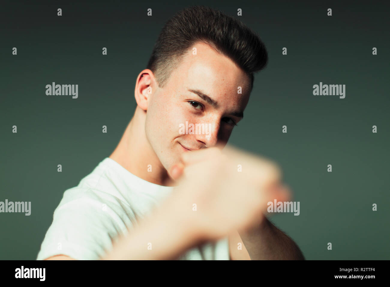 Portrait playful, cool teenage boy in fighting stance Stock Photo - Alamy