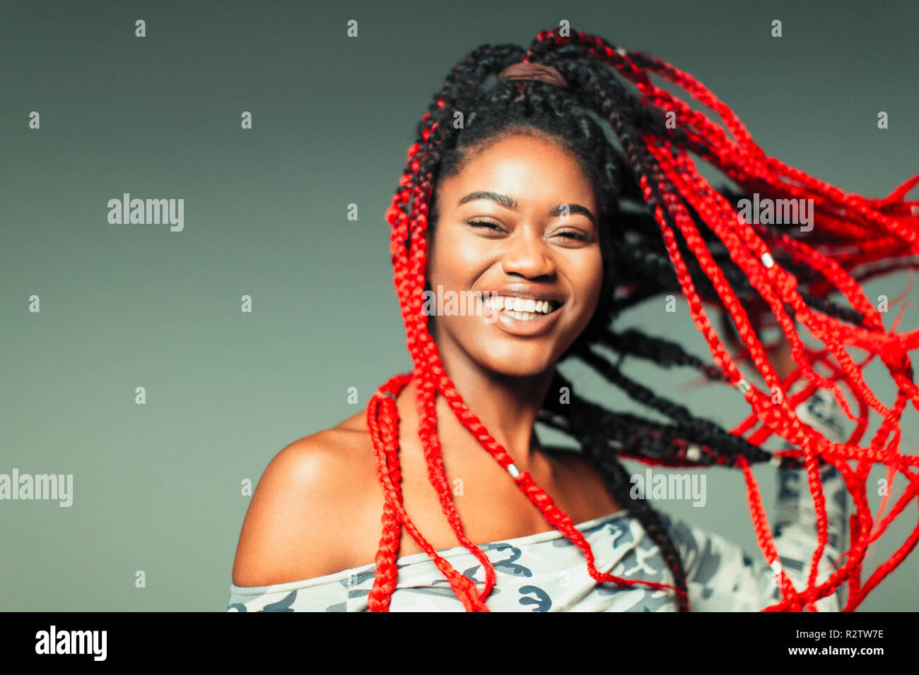 Portrait confident, carefree young woman with red braids Stock Photo ...