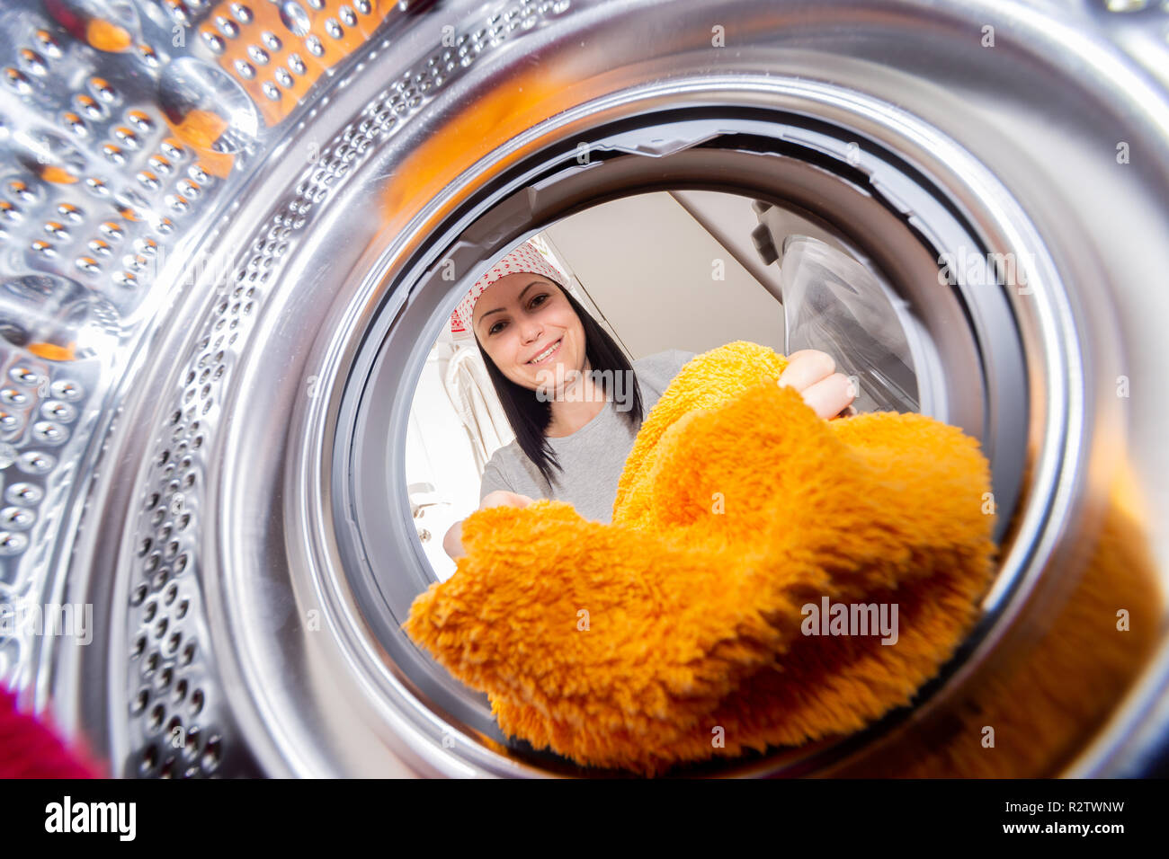 Loading washing machine hi-res stock photography and images - Alamy