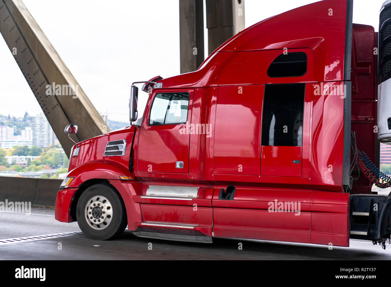 Profile of modern American bonnet long haul red big rig semi truck with ...
