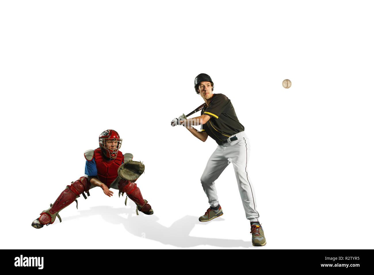 The fit caucasian men baseball players playing in studio. silhouettes ...
