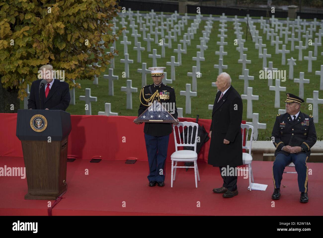 President Donald J. Trump presents an American flag to Secretary of the ...