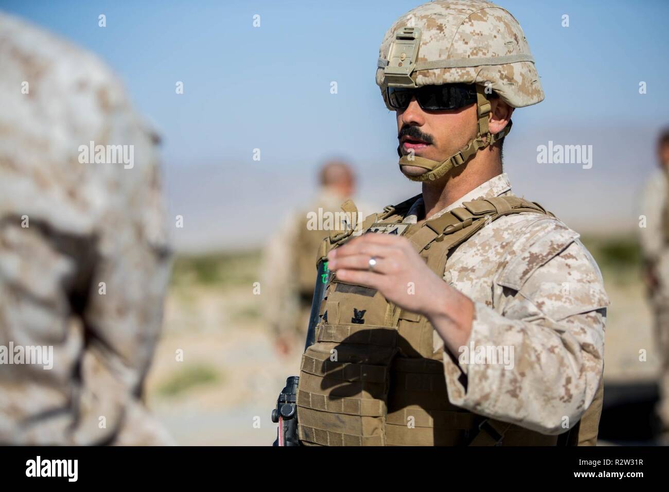 U.S. Marine Sgt. Aaron T. Holbrook briefs Marines on airfield damage ...