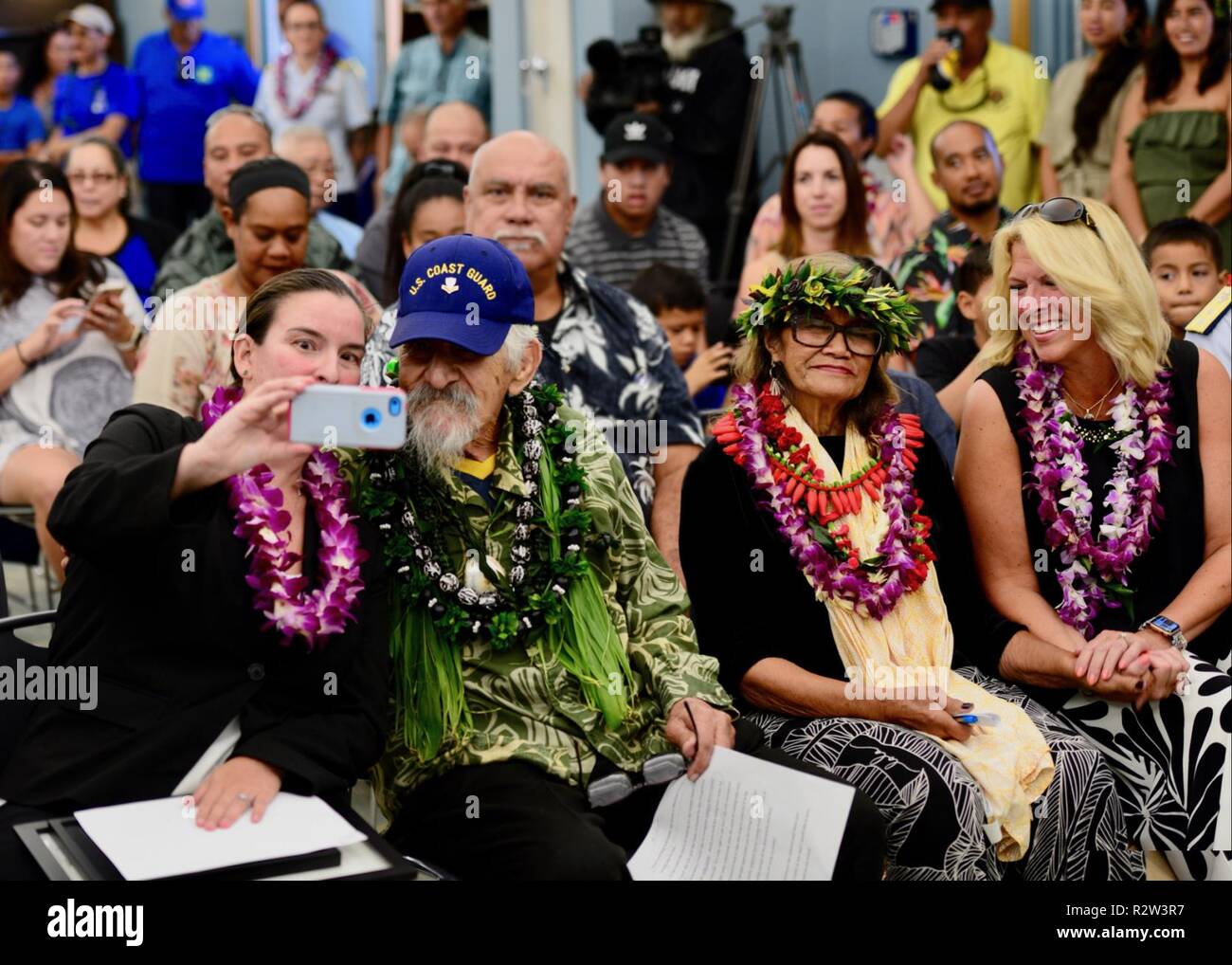 Rebecca Crall, on behalf of State Rep. Lynn DeCoite, takes a photo with ...