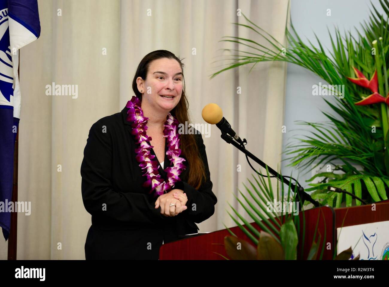 Rebecca Crall reads a letter on behalf of Rep. Lynn DeCoite, during a ...