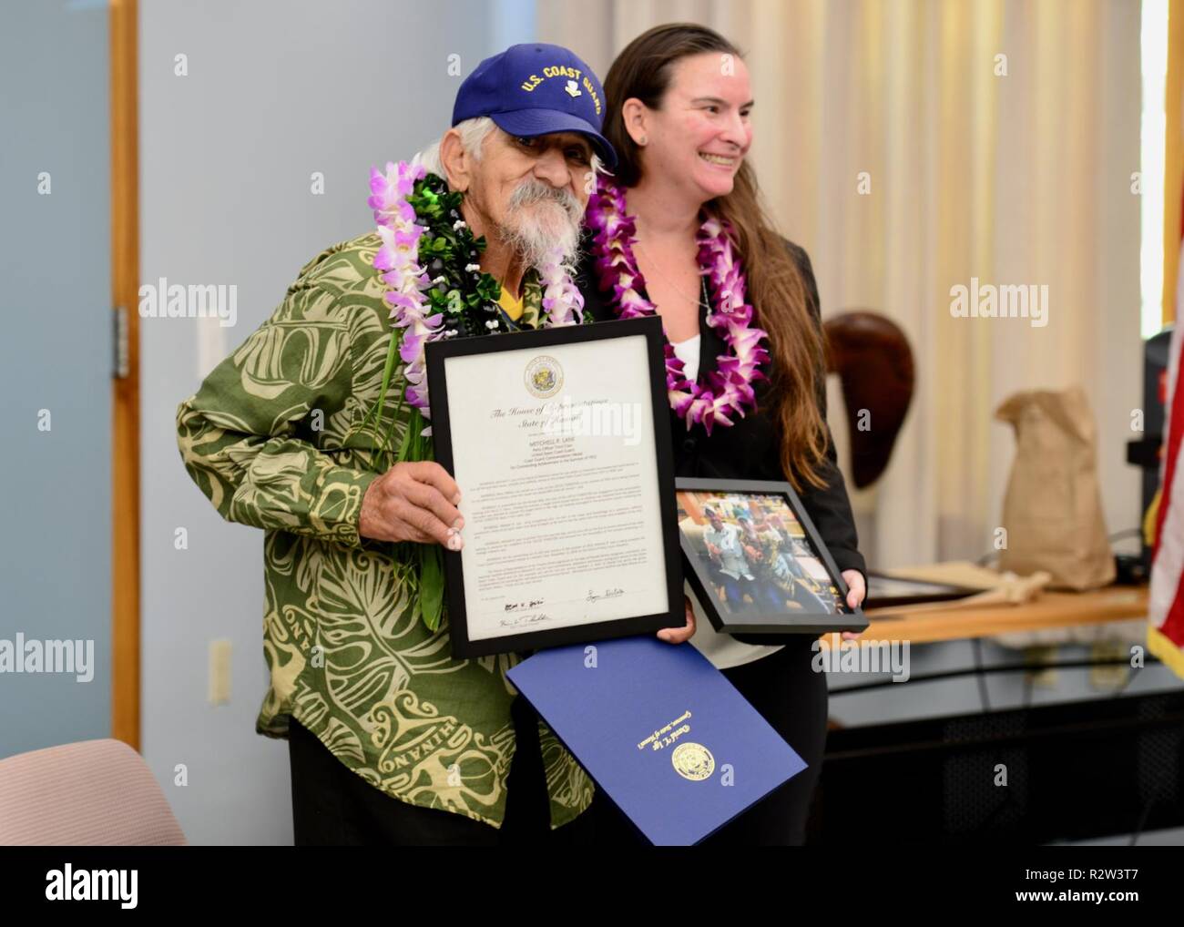 Rebecca Crall presents a certificate on behalf of Rep. Lynn DeCoite ...