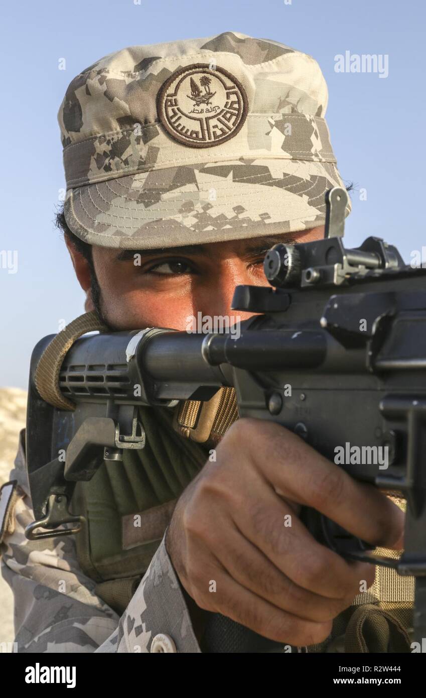 UM HATTAH, Qatar – A Qatari soldier fires an M4 carbine during bunker ...
