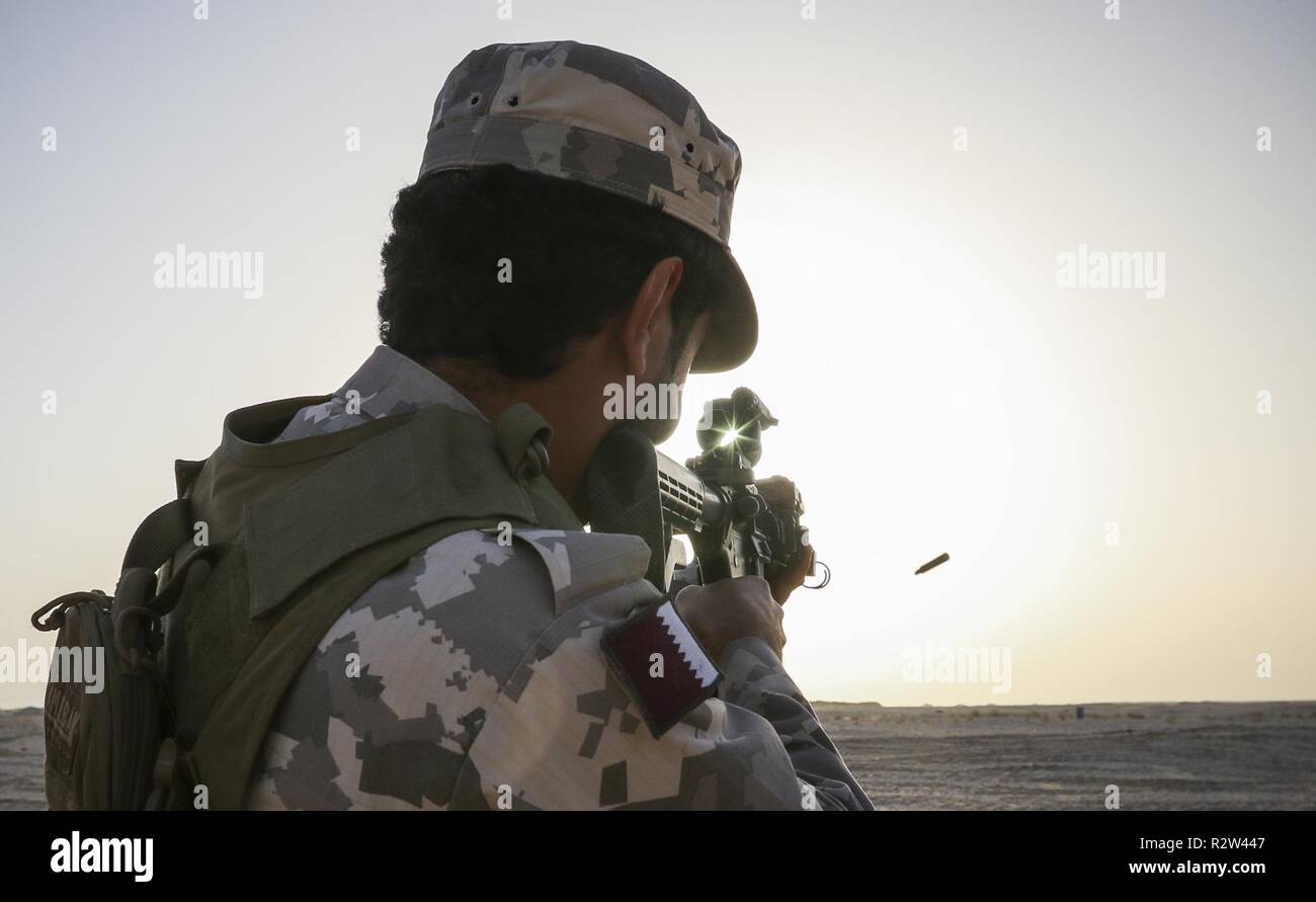 A Qatari soldier engages a simulated target with an M4 carbine during ...
