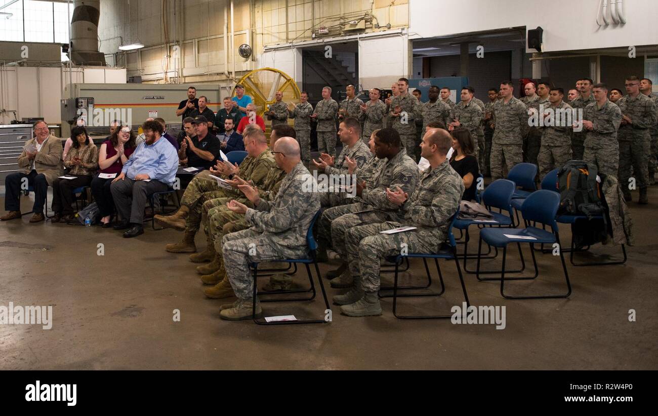 An audience claps during the Chief Master Sgt. Alvin R. Benner Street ...